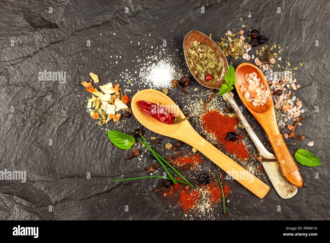 Different types of spice on slate plate. Sale of spices. Preparation of ...