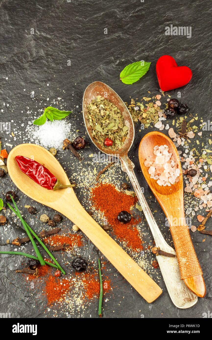 Different types of spice on slate plate. Sale of spices. Preparation of ...