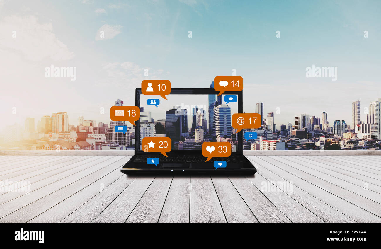 Computer laptop on wooden desk and social media with social network ...