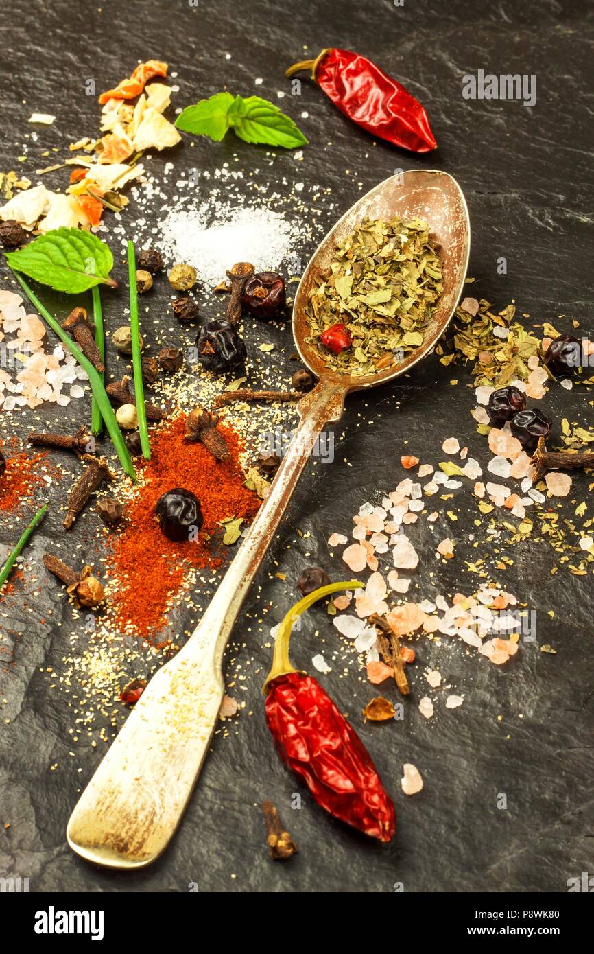 Different types of spice on slate plate. Sale of spices. Preparation of ...