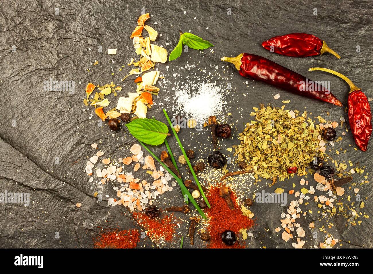 Different types of spice on slate plate. Sale of spices. Preparation of ...
