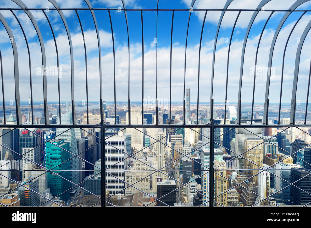 New York City Manhattan skyline aerial view at evening through a fence ...