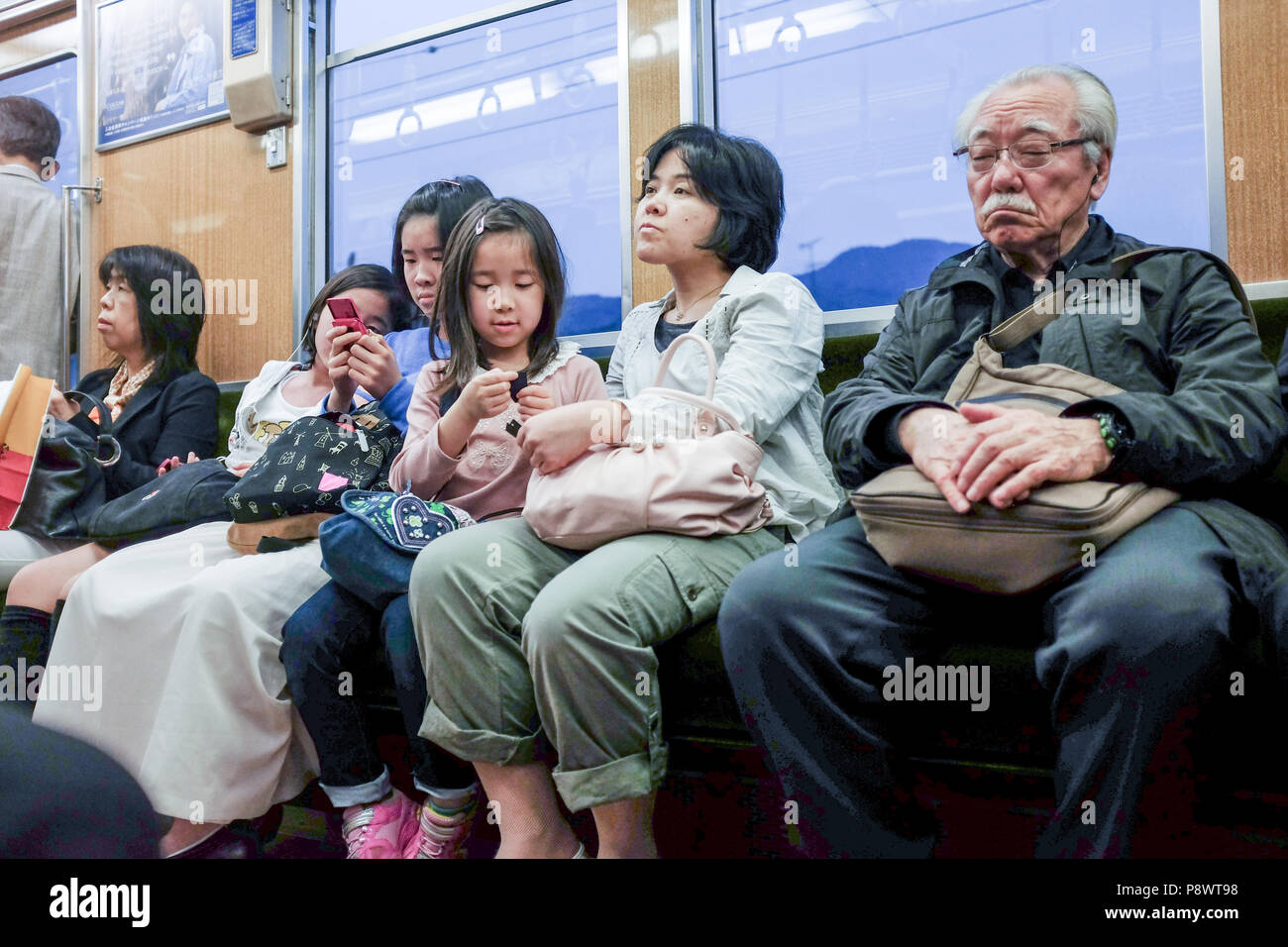 Commuters on Hankyu Railway Kobe line. This is one of three major ...