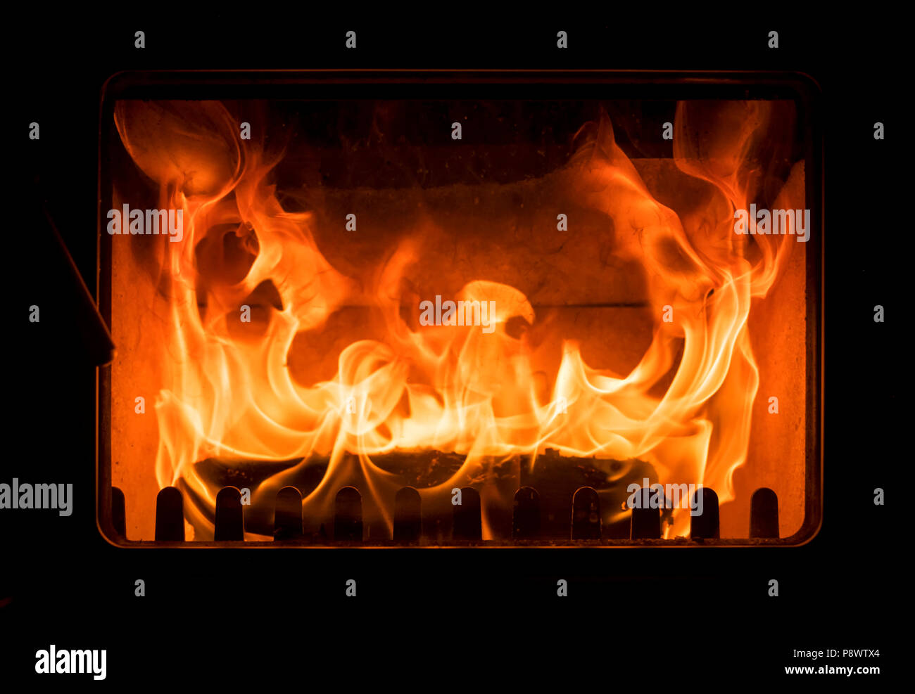 Relaxing fire in a closed fireplace Stock Photo - Alamy