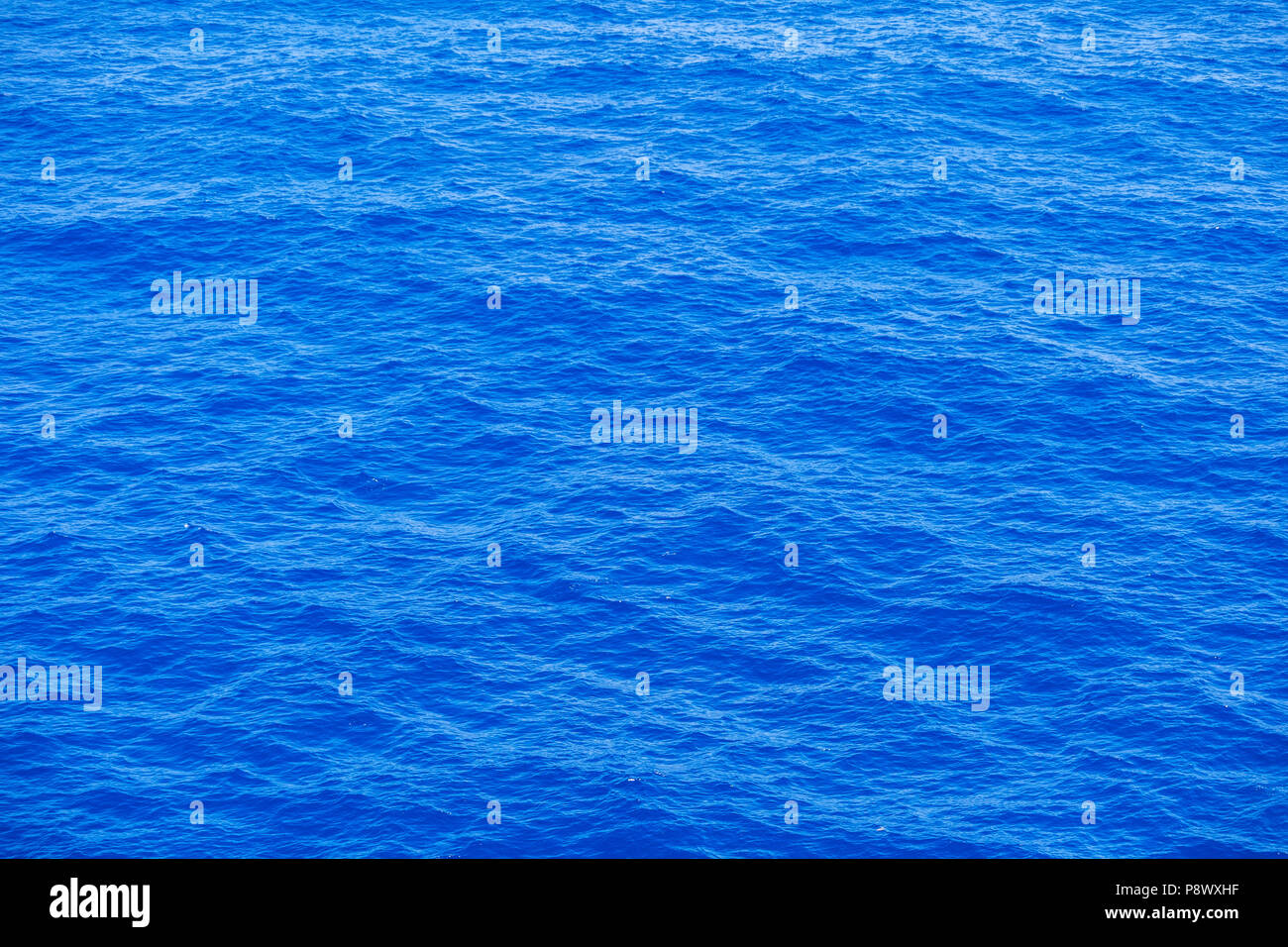 Vast blue ocean background with moderate waves Stock Photo - Alamy