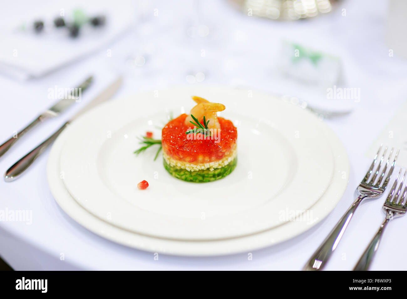 Fancy fish dish on a white plate Stock Photo - Alamy
