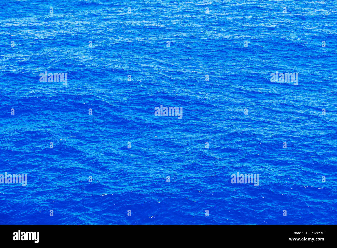 Vast blue ocean background with moderate waves Stock Photo - Alamy