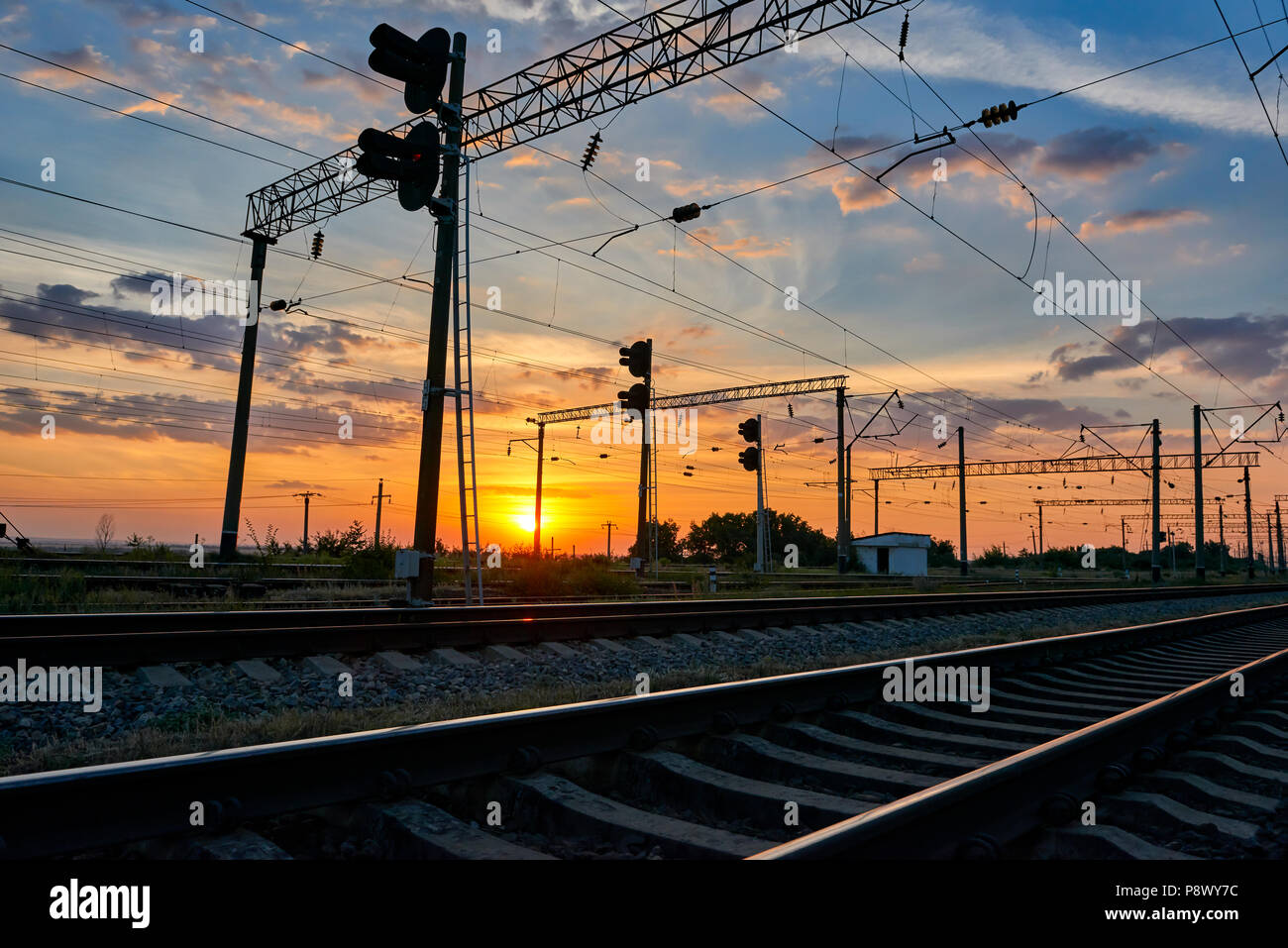 railroad infrastructure during beautiful sunset and colorful sky ...