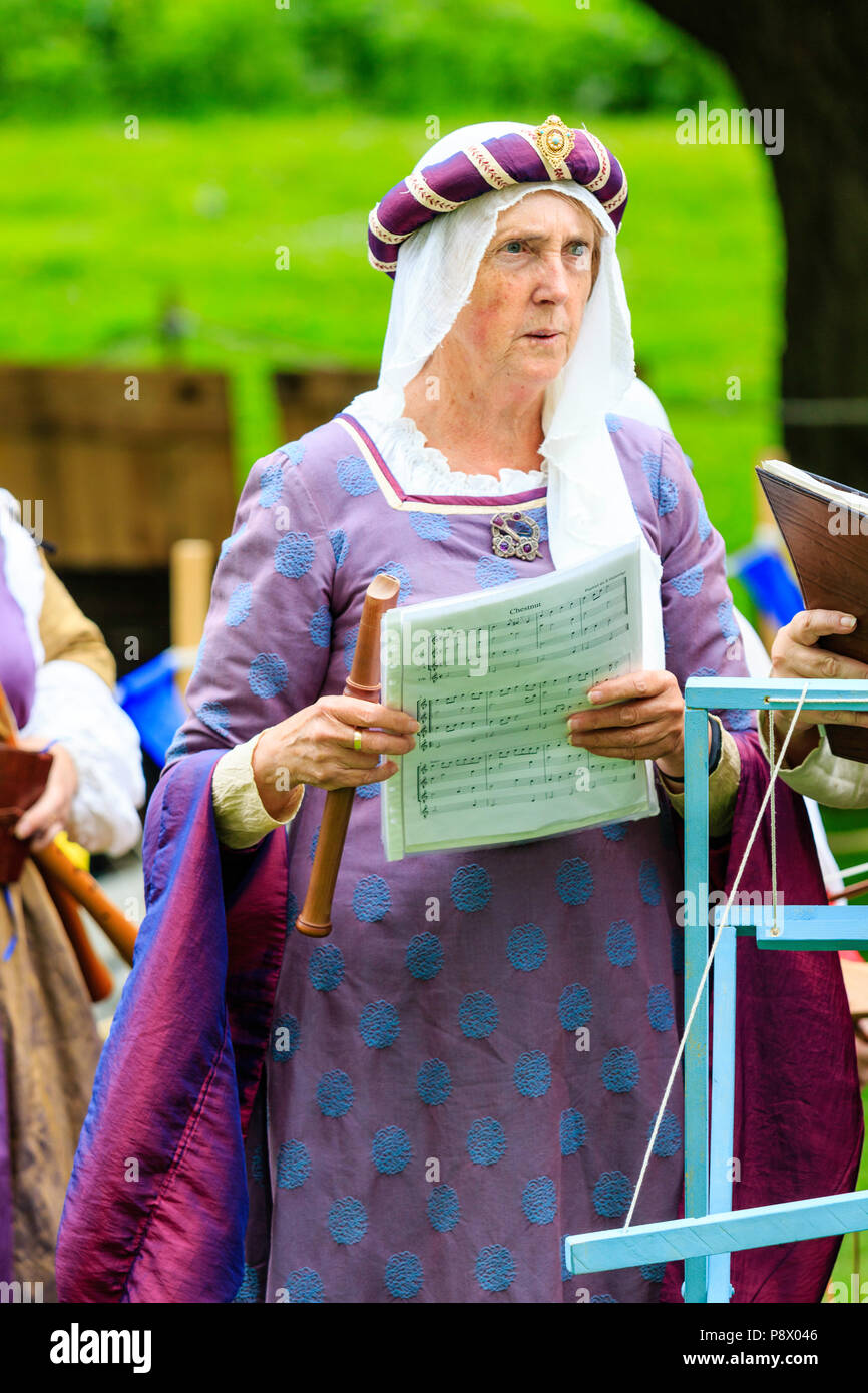Medieval Living history reenactment. Mature woman, 50s, dressed in ...