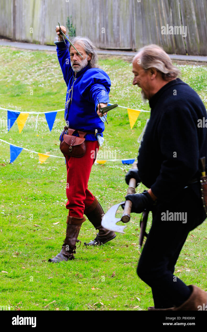 Medieval Living history reenactment event. Two men, dressed in medieval ...