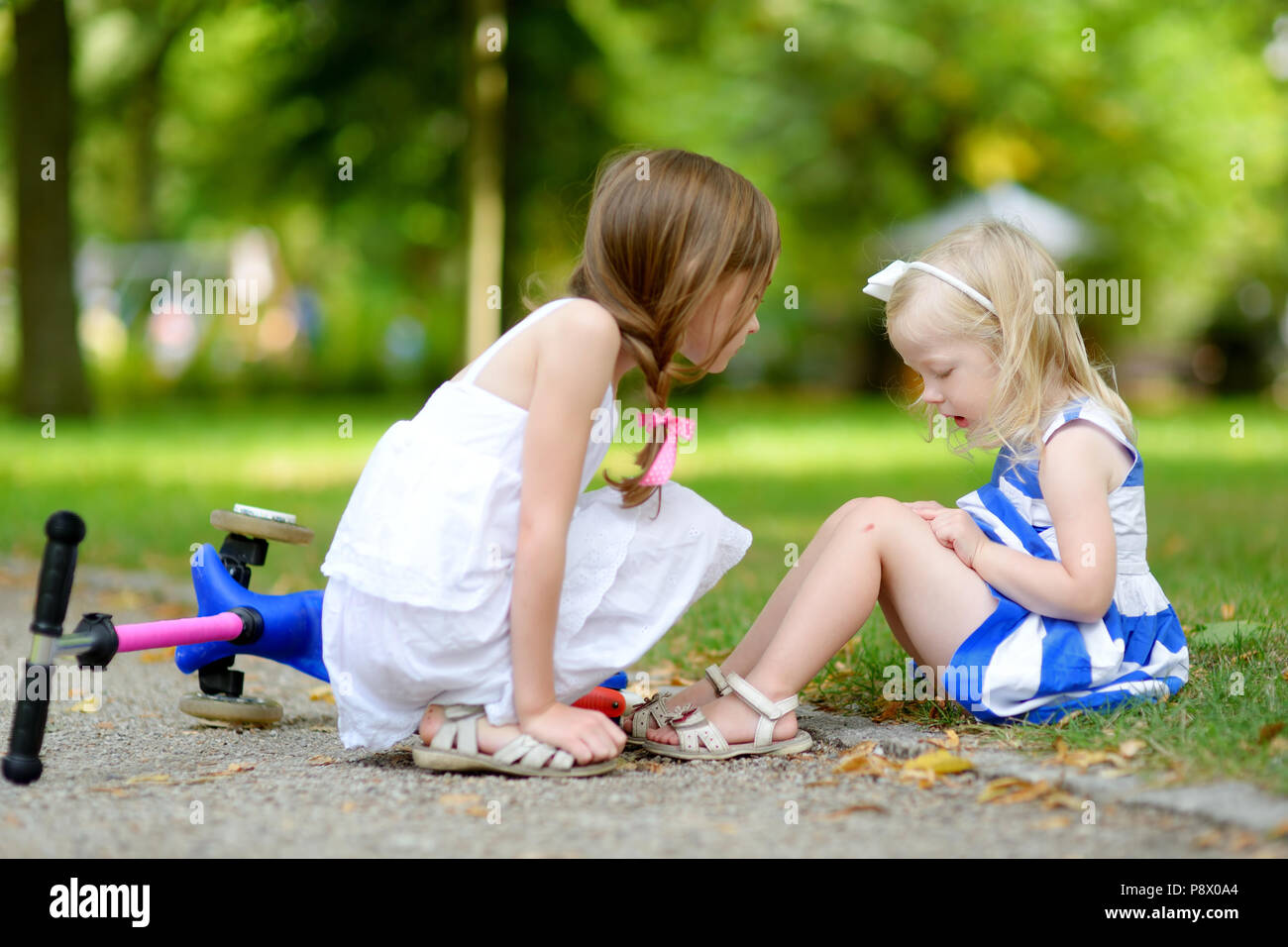 Comforting injured child hi-res stock photography and images - Alamy