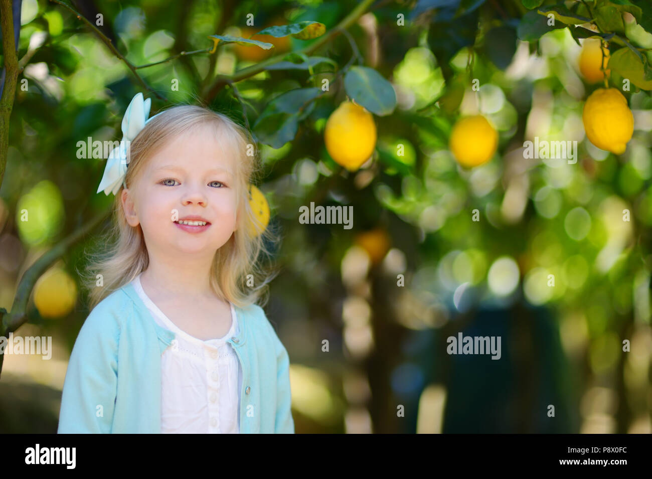 Lemon tree and girl hi-res stock photography and images - Alamy