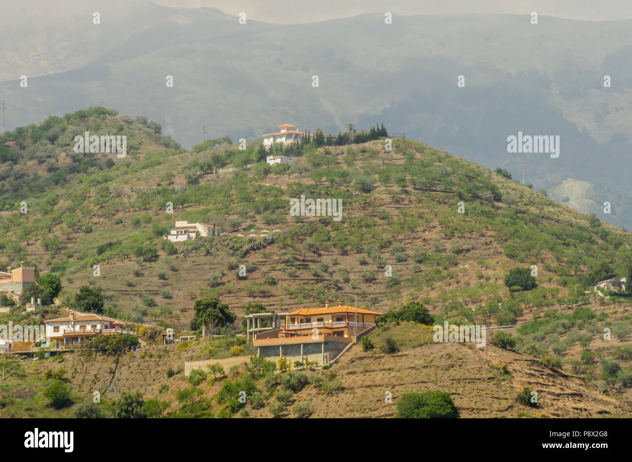 typical spanish village houses and farmland in the hills of andalusia ...