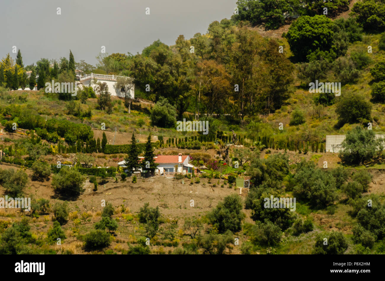 typical spanish village houses and farmland in the hills of andalusia ...
