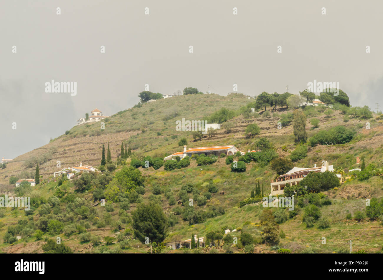 typical spanish village houses and farmland in the hills of andalusia ...