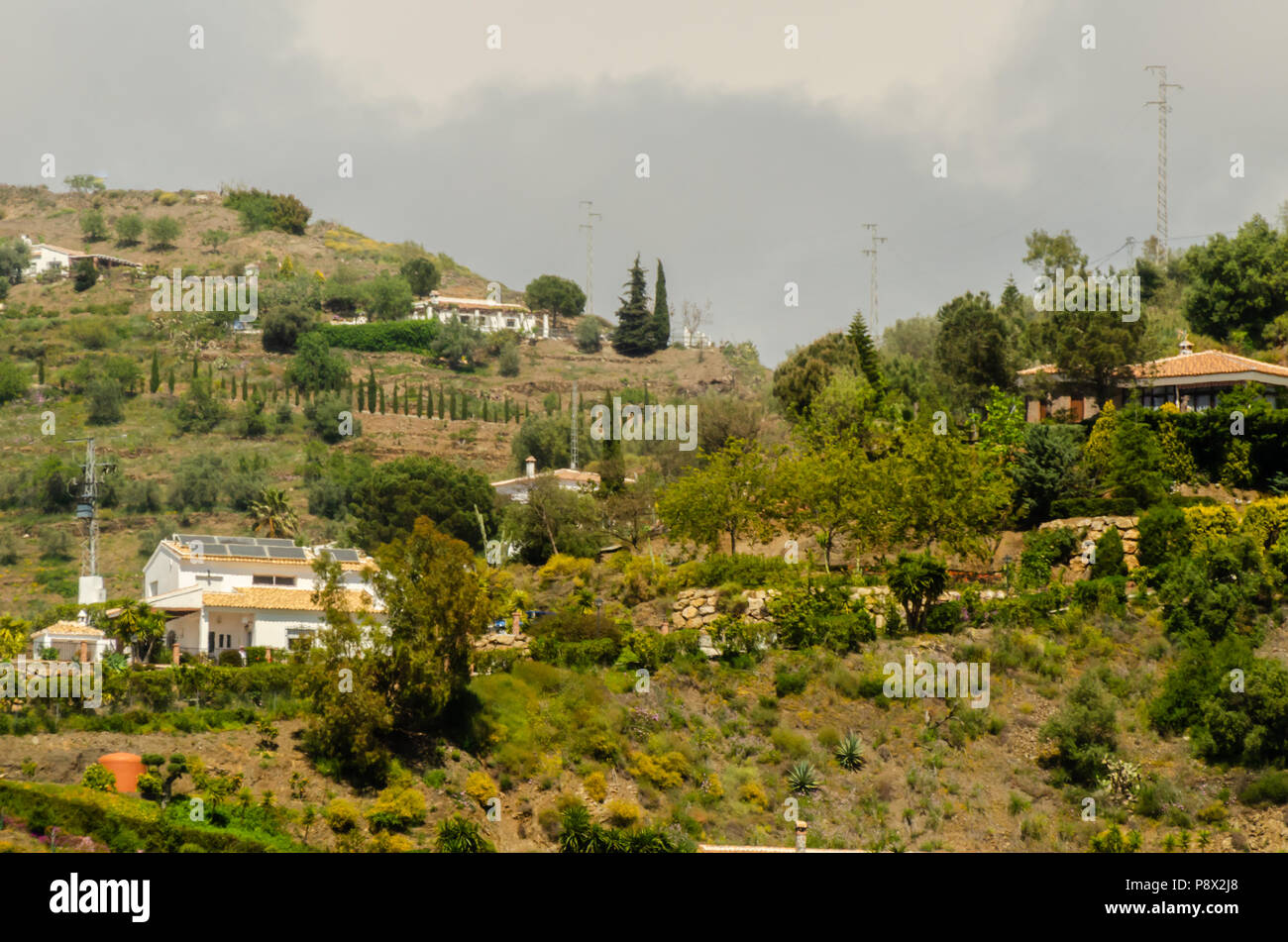 typical spanish village houses and farmland in the hills of andalusia ...
