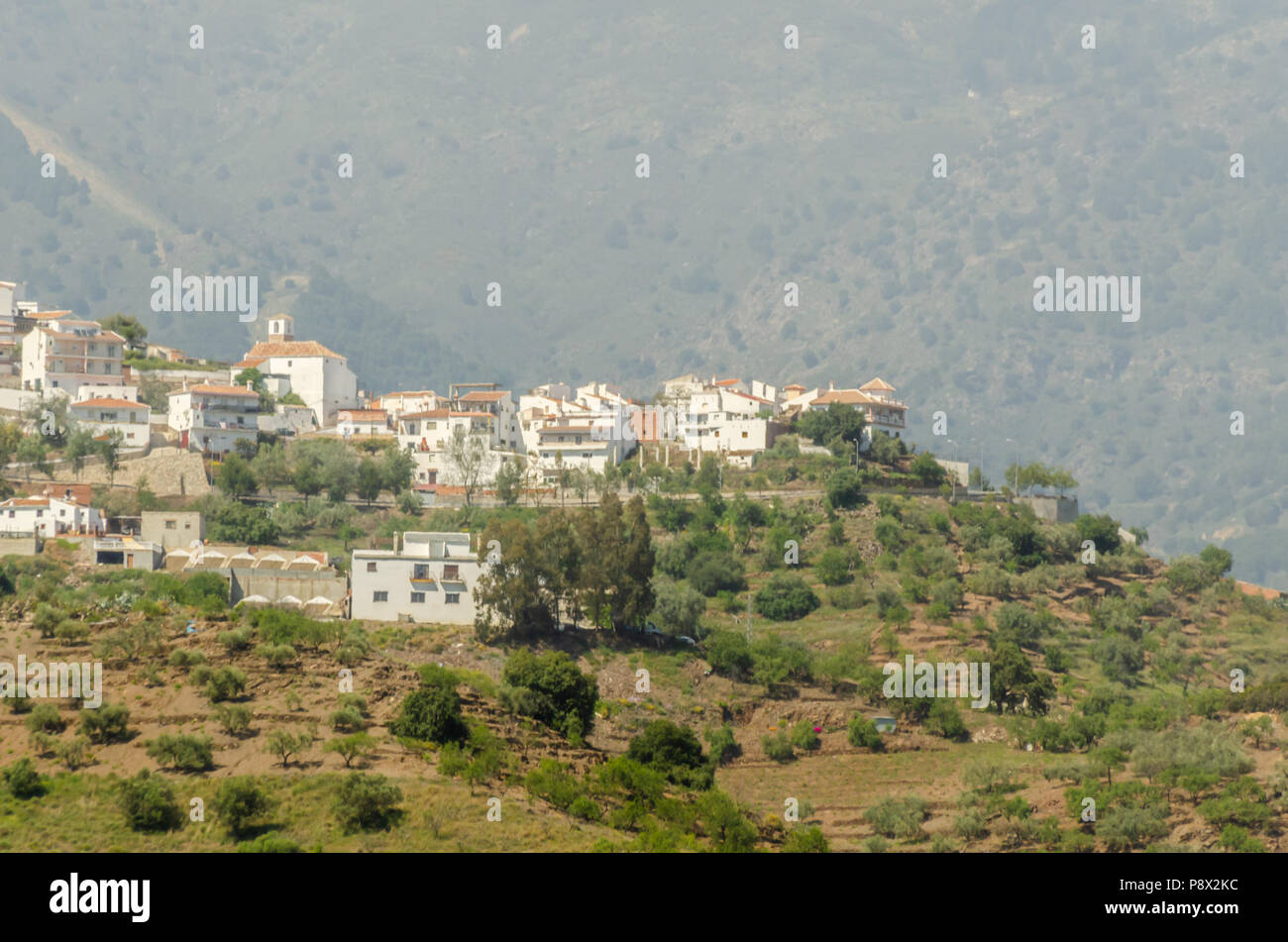 typical spanish village houses and farmland in the hills of andalusia ...