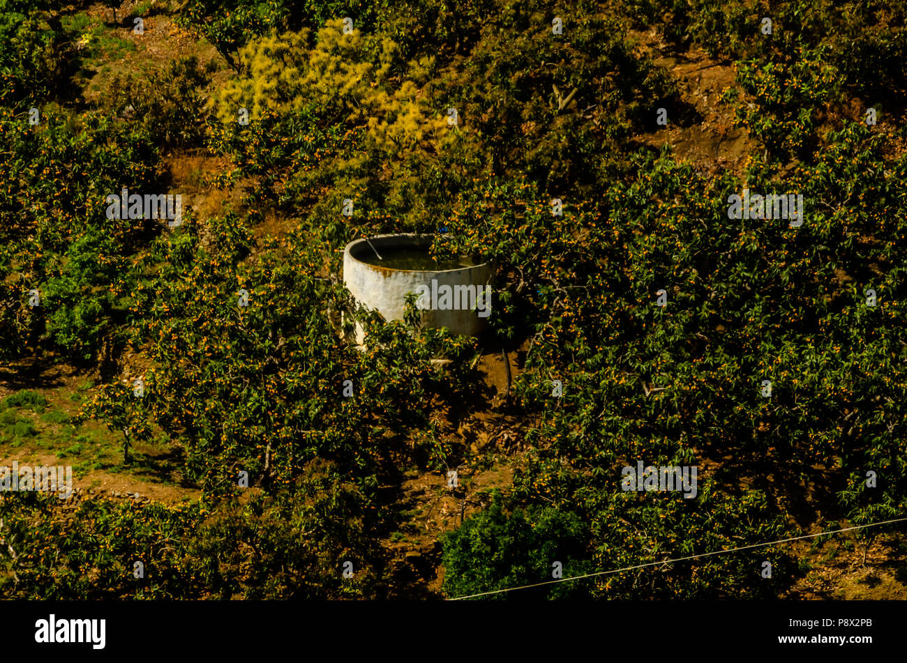 Concrete irrigation basin on high hills in Andalusia, a place of water ...