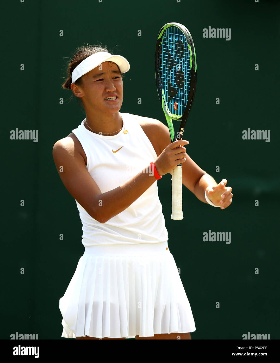 Xiyu Wang in action on day eleven of the Wimbledon Championships at the ...