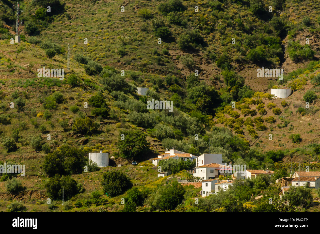 typical spanish village houses and farmland in the hills of andalusia ...