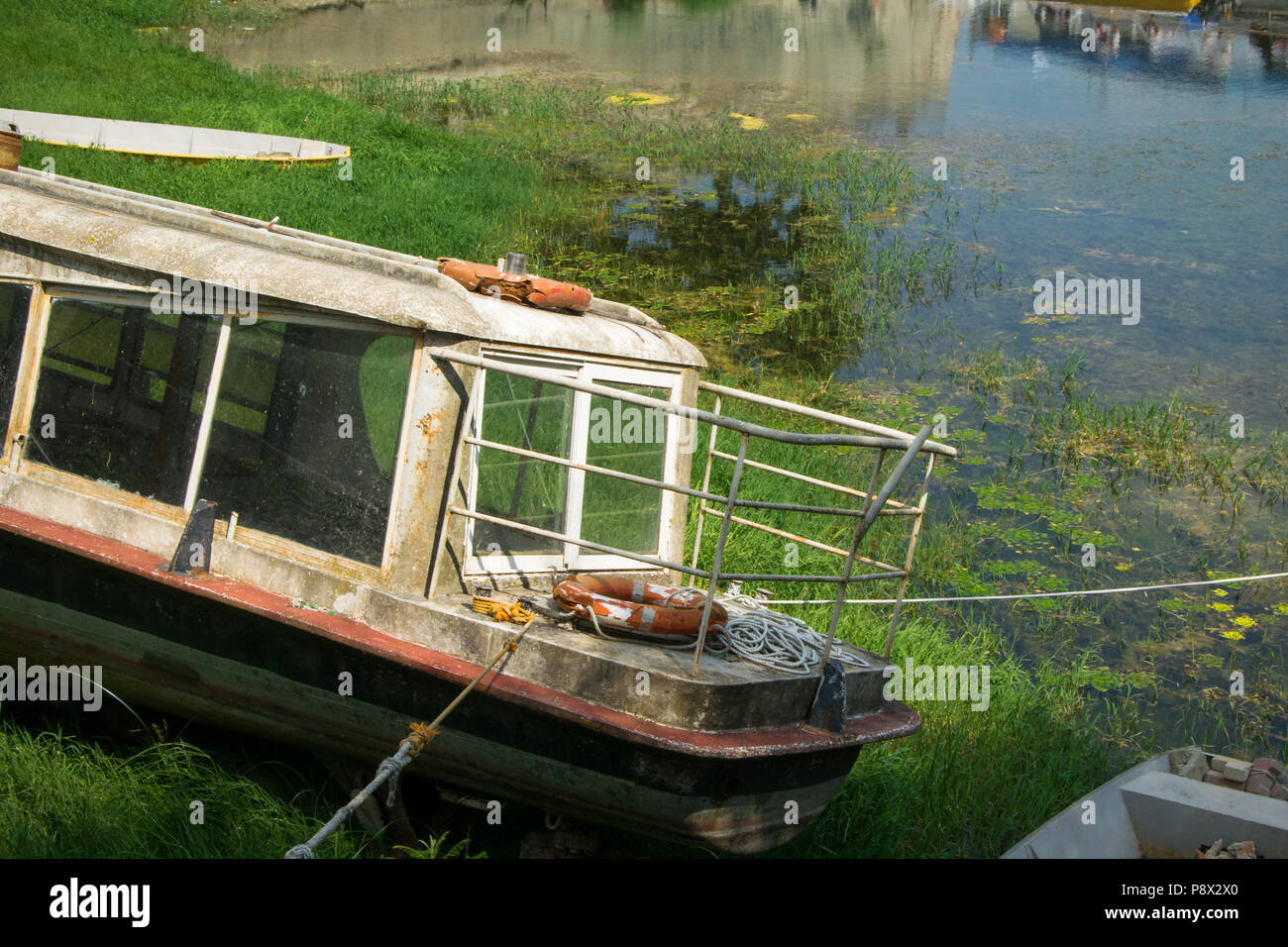 Old broken abandoned ferry for passengers on the rivershore Stock Photo ...