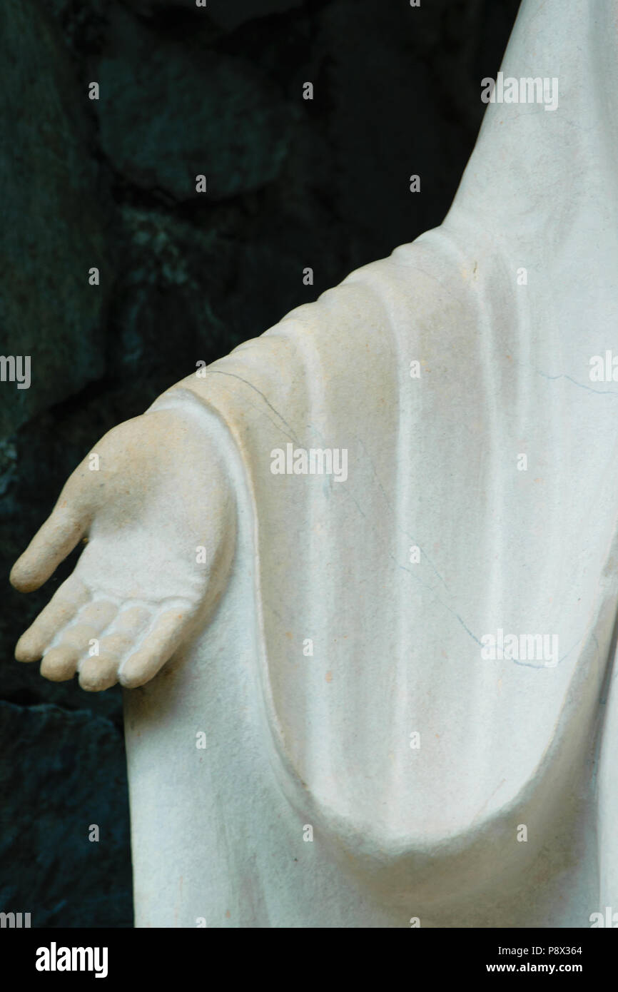 Detail of the open hand of a statue of Saint Mary Stock Photo - Alamy
