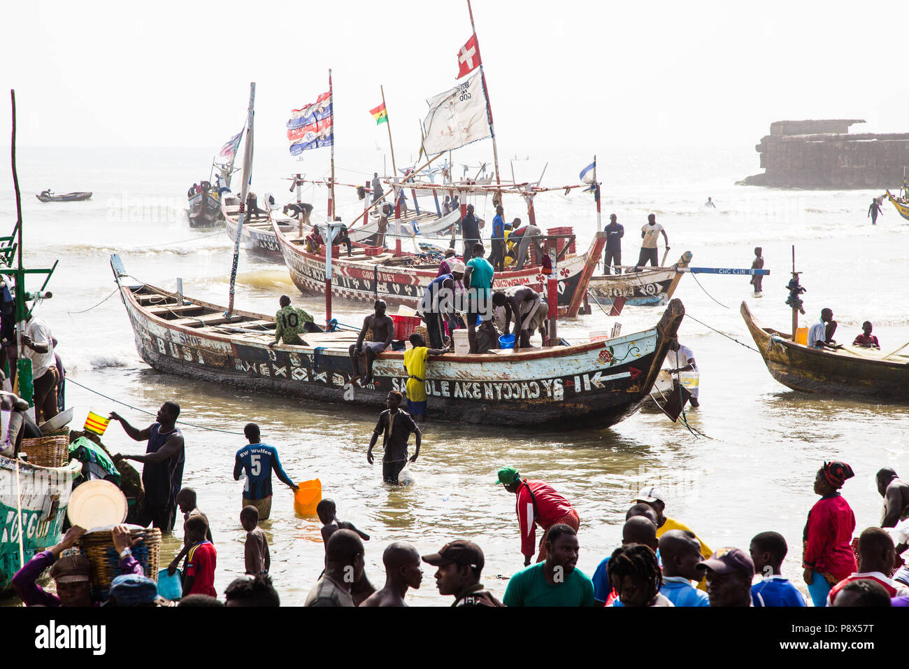 Fishing boats in the sea with fishermen, Accra, Ghana Stock Photo - Alamy