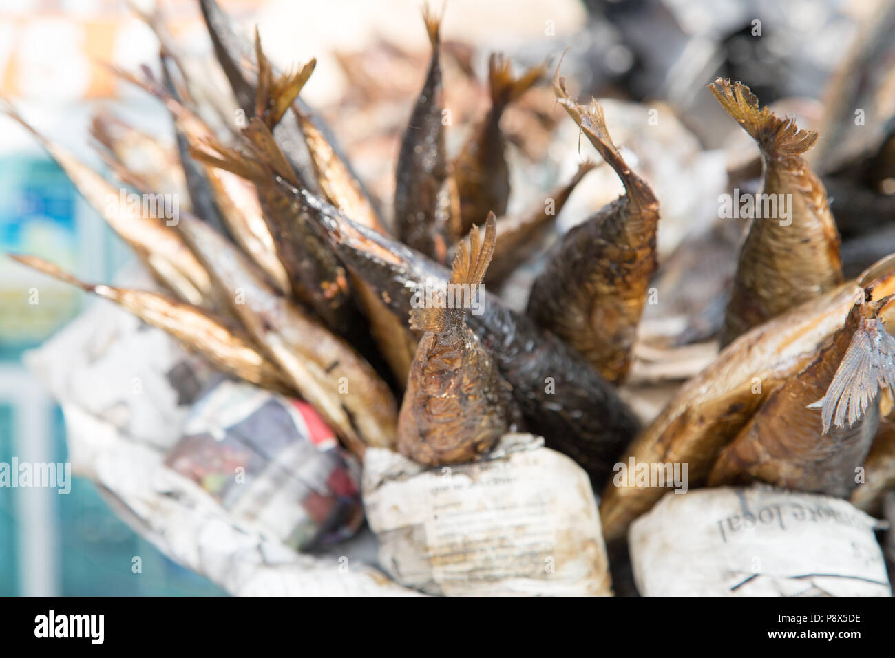 Fish wrapped in newspaper hi-res stock photography and images - Alamy