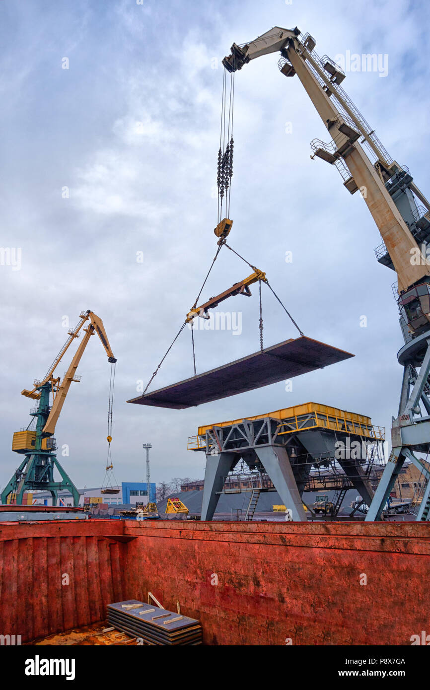 Industrial crane loading Containers in a Cargo freight ship Stock Photo ...
