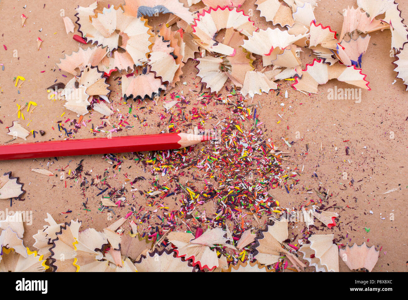 Red Color Pencil over some pencil shavings Stock Photo - Alamy