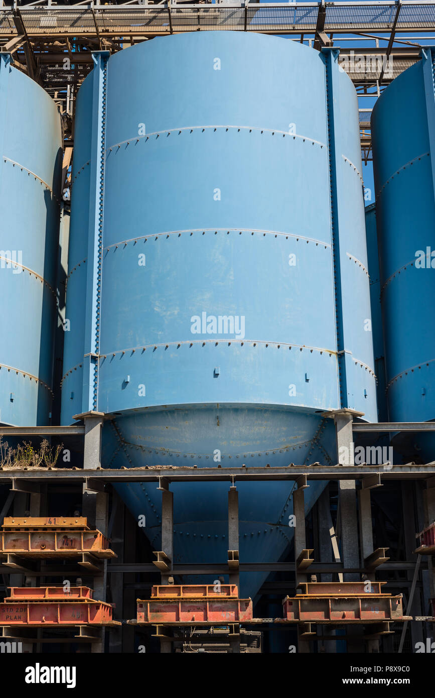 Big blue metallic Industrial silos for the production of cement at an ...