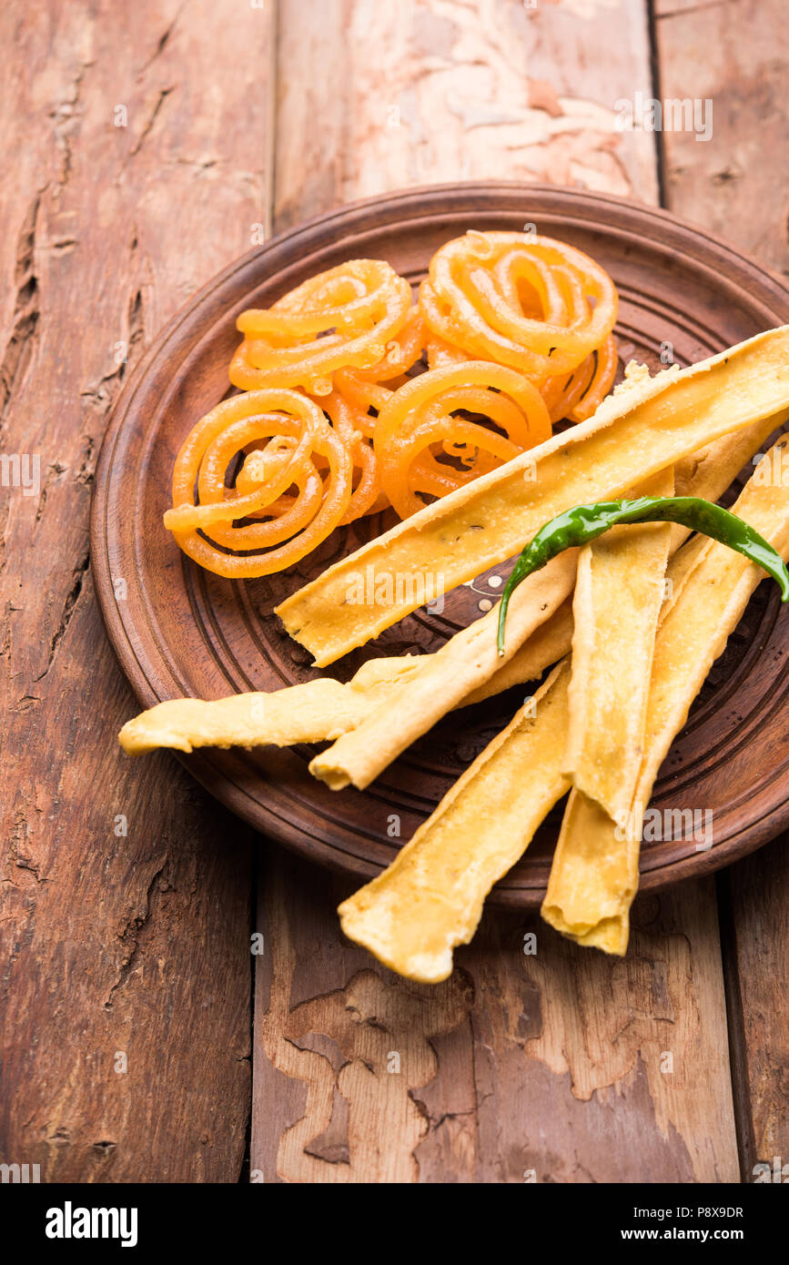 Crispy Fafda with sweet jalebi is an Indian snack most popular in Gujarat, selective focus Stock ...