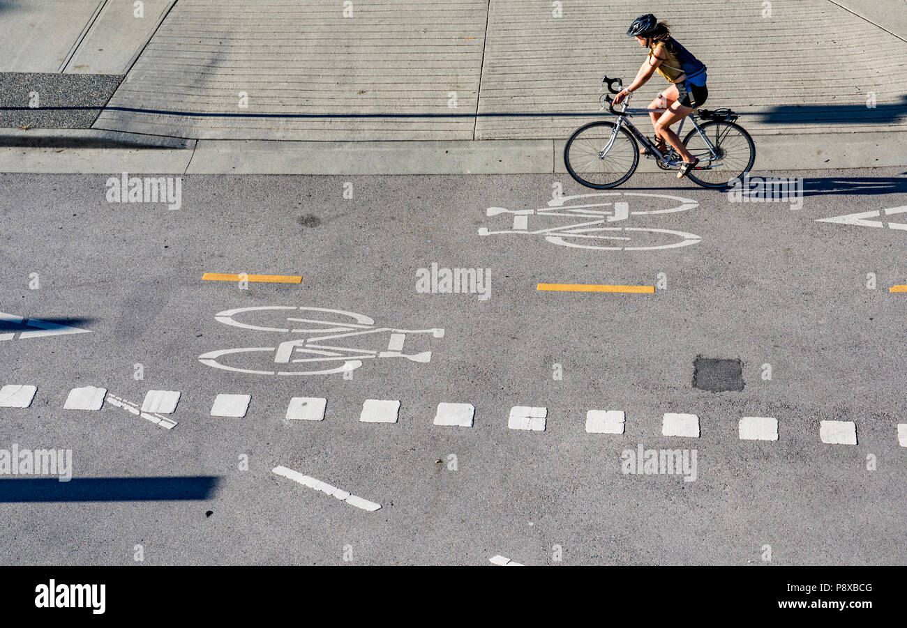 Cyclist using dedicated bike lane, Vancouver, British Columbia, Canada ...