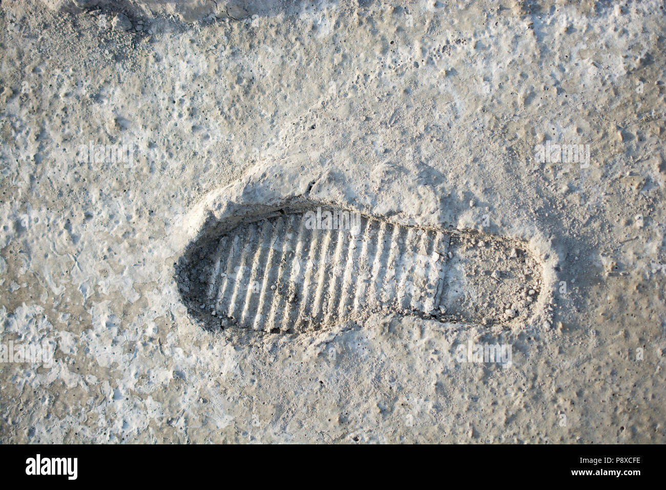 Footstep pattern seen on a concrete background Stock Photo - Alamy
