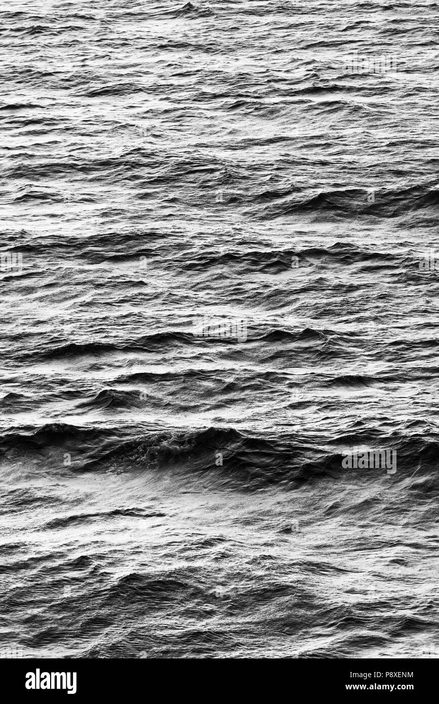 Ocean waves with small white caps background in black and white Stock ...