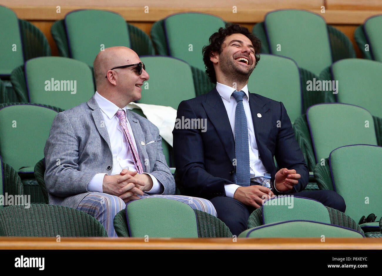 Aidan Turner and Richard Cook (left) in the royal box on centre court ...