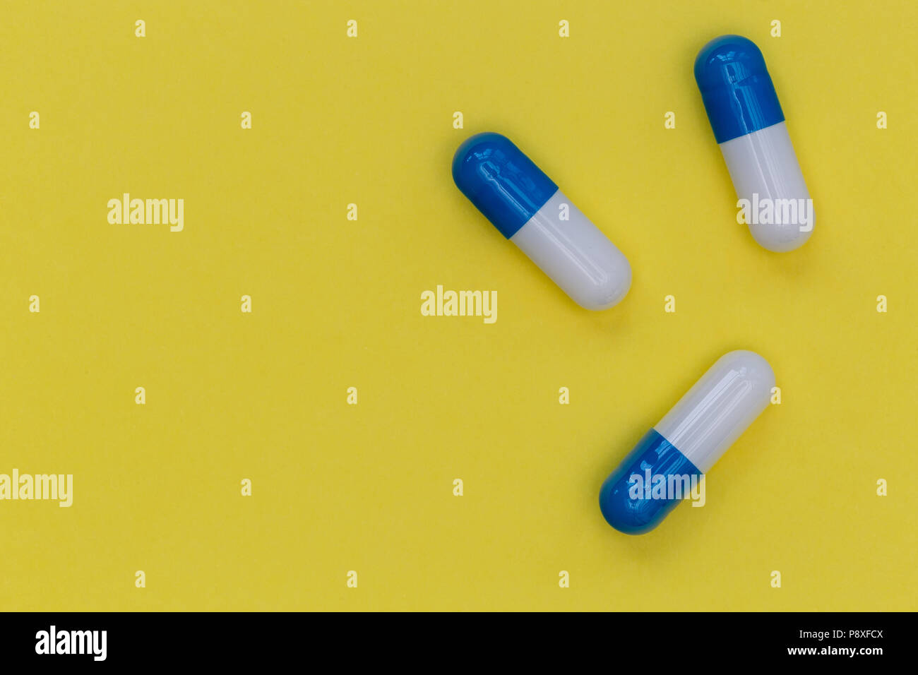 Yellow capsules drugs hi-res stock photography and images - Alamy
