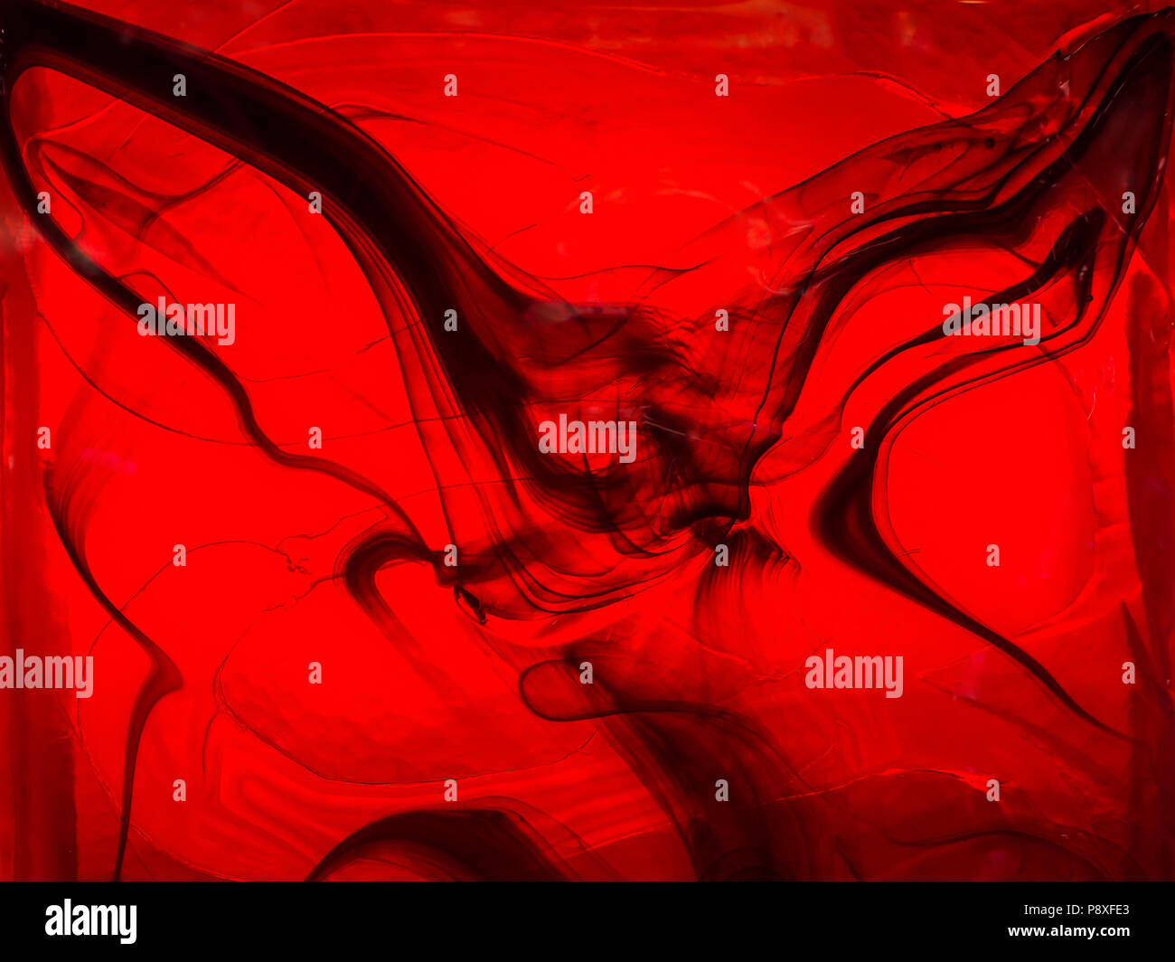 Light reflects through the red glass block in abstract form Stock Photo ...