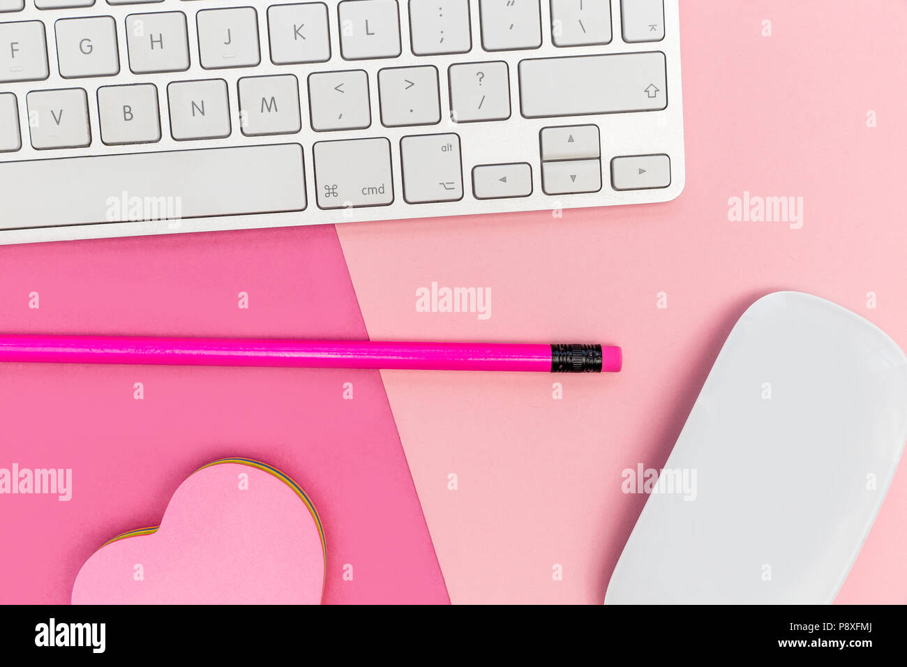 Computer keyboard on bright pink background minimal workspace concept ...