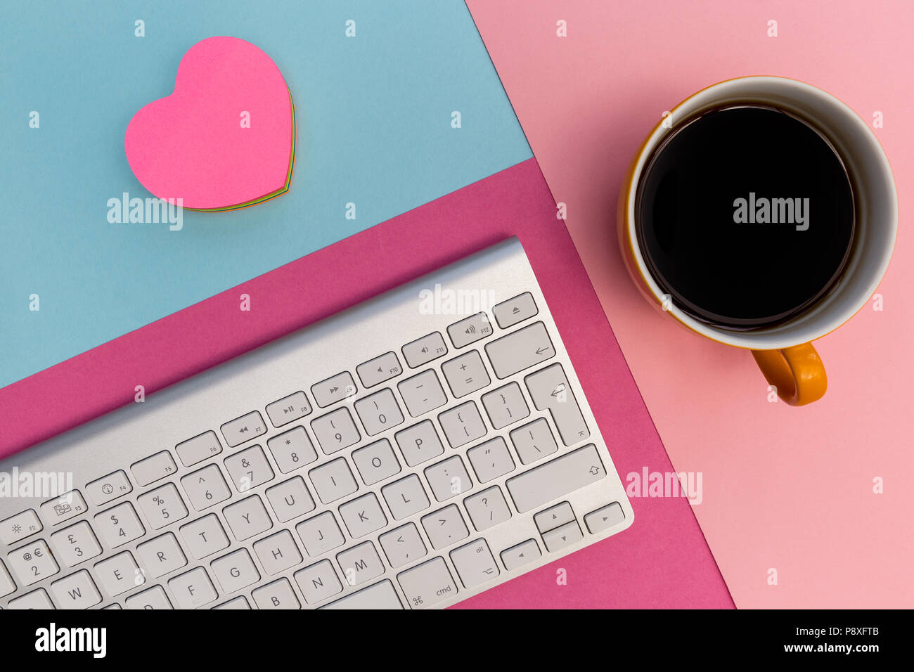 Computer keyboard on bright pink background minimal workspace concept ...