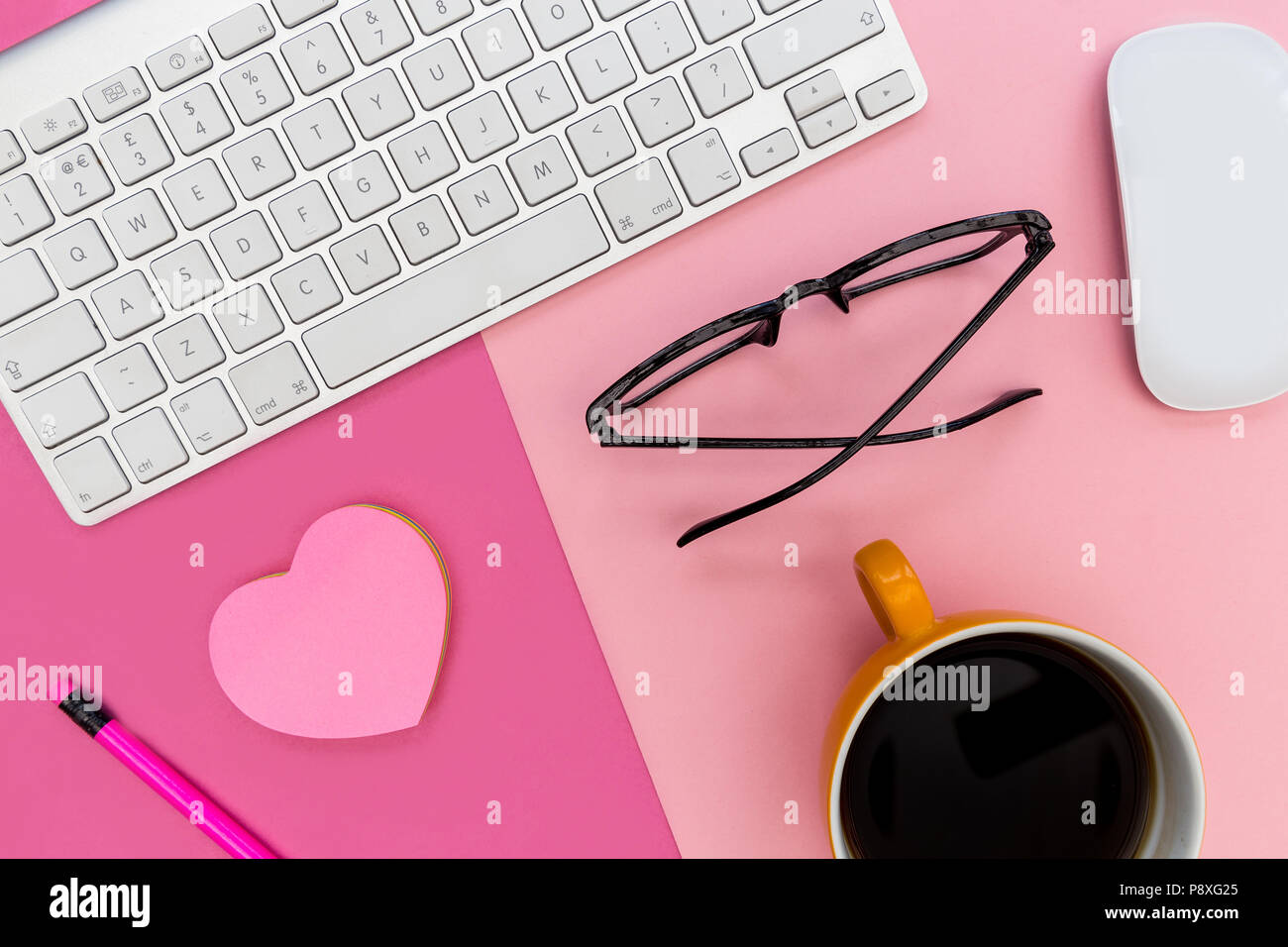 Computer keyboard on bright pink background minimal workspace concept ...