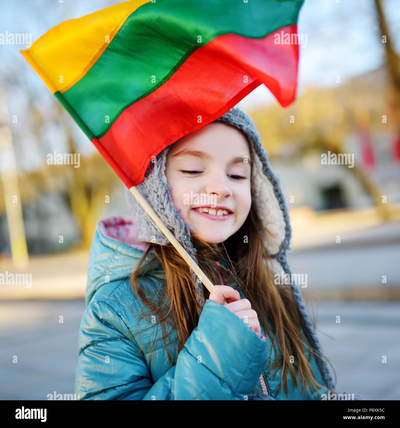 Cute little girl celebrating Lithuanian Independence Day holding ...
