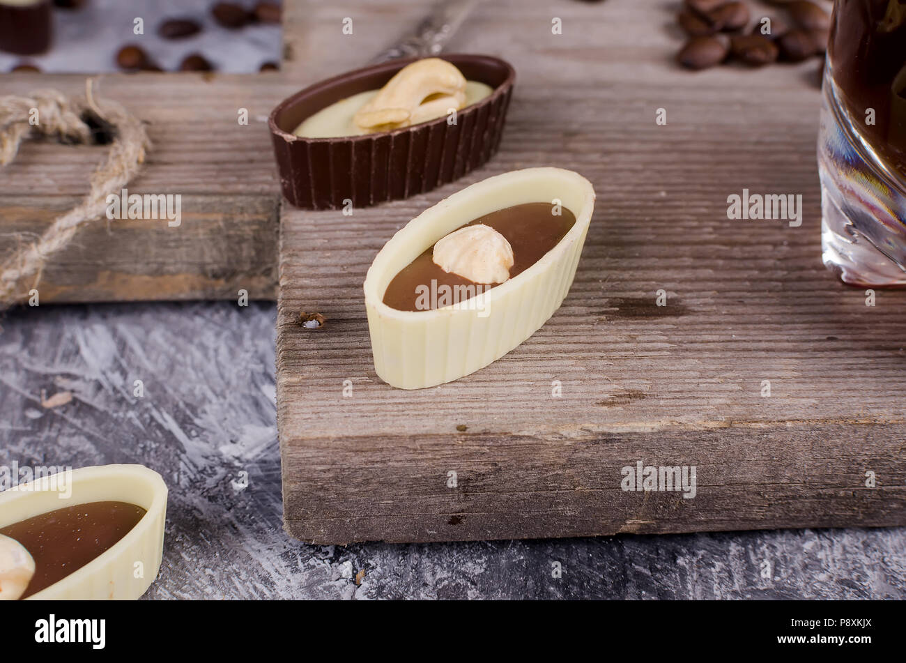 chocolate candy boat with nut on a concrete background dessert for ...