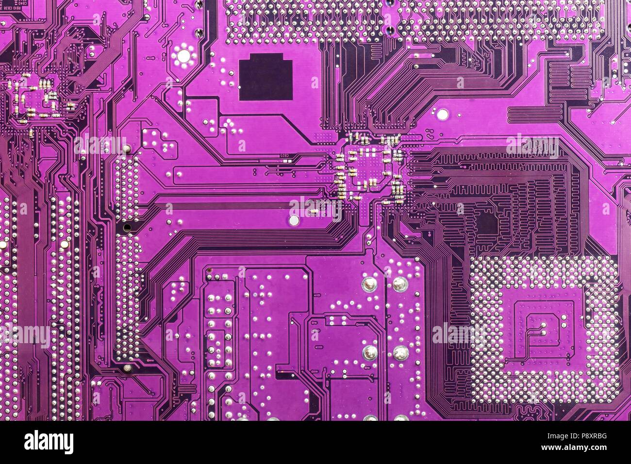 Violet circuit board background of computer motherboard.Computer chip ...