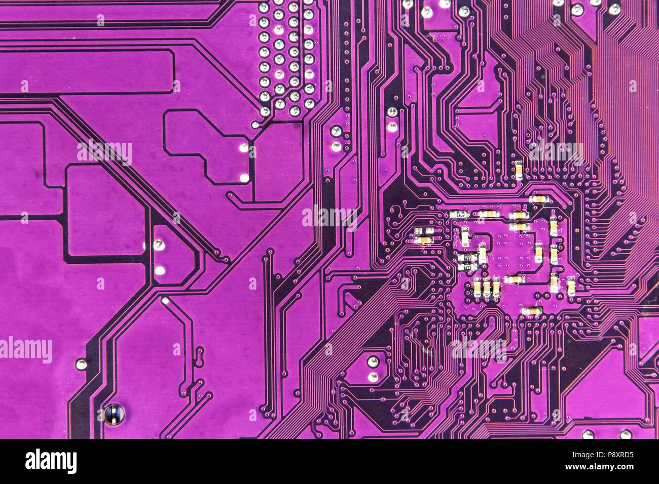 Violet circuit board background of computer motherboard.Computer chip ...