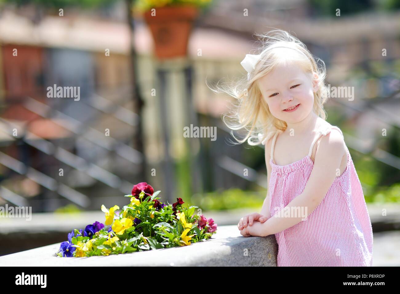 Adorable little girl on warm and sunny summer day Stock Photo - Alamy