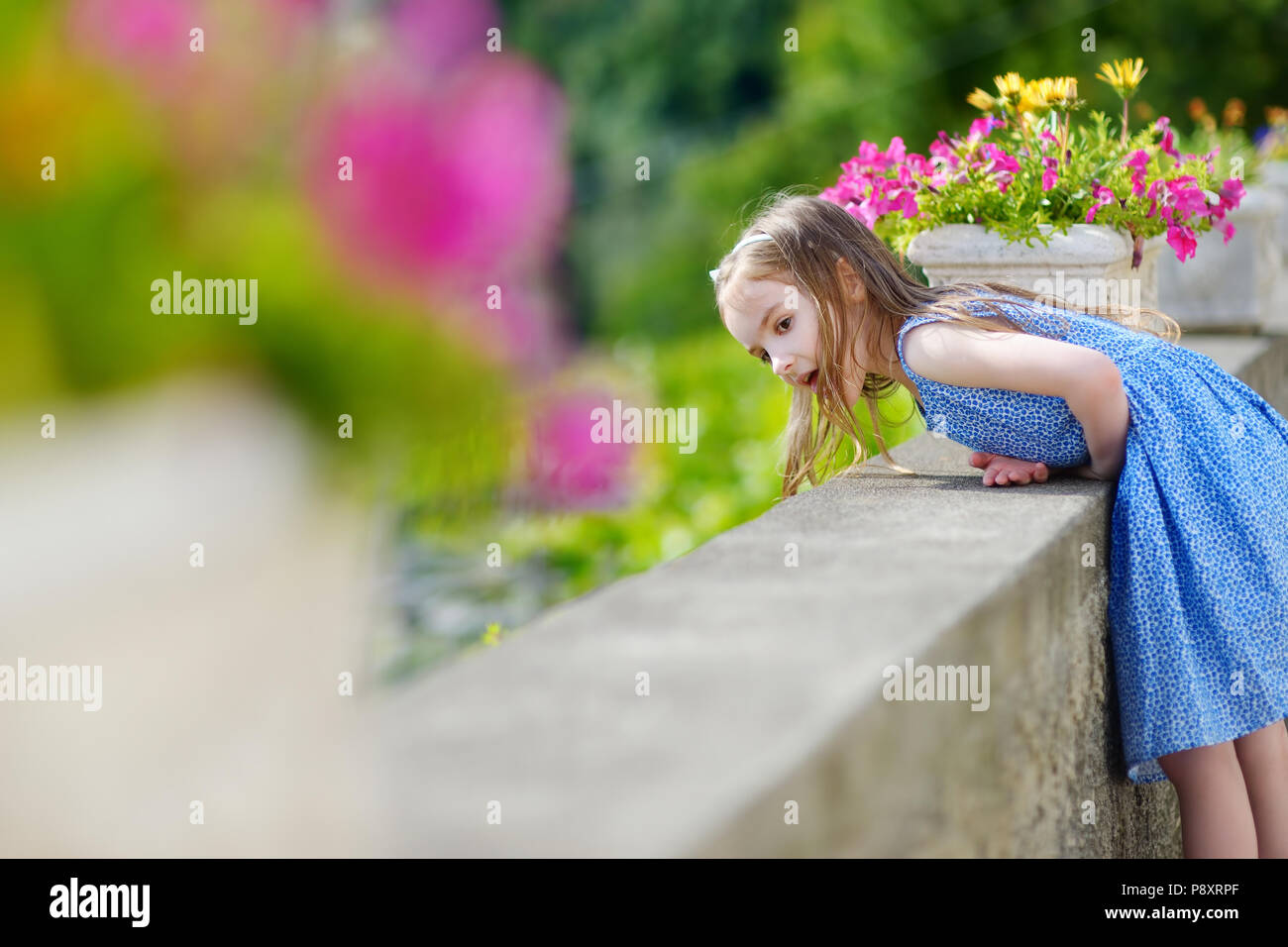 Adorable little girl on warm and sunny summer day Stock Photo - Alamy