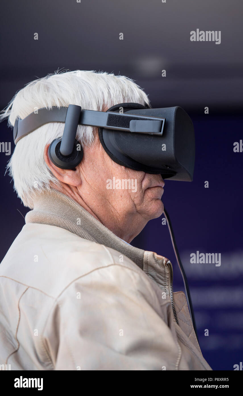 Senior man using a virtual reality headset Stock Photo - Alamy