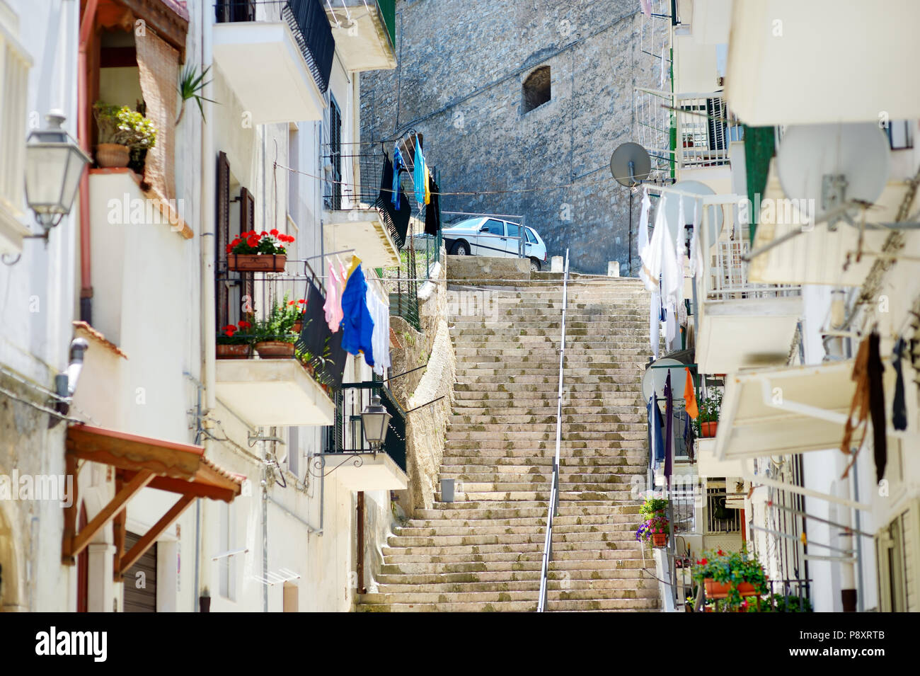Typical medieval narrow street in beautiful town of Vieste, Italy Stock ...