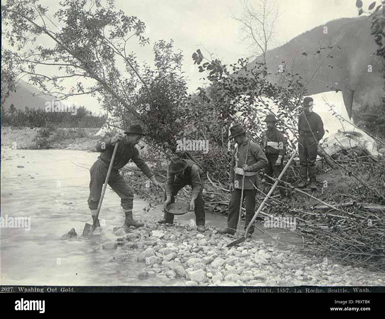 . 287 Five prospectors panning for gold in a creek, Alaska, 1897 ...